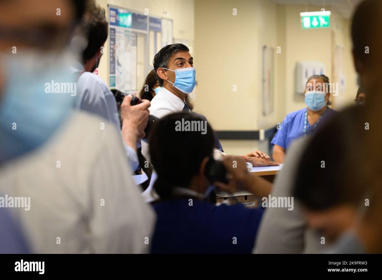 Prime Minister Rishi Sunak speaks with members of staff during a visit ...