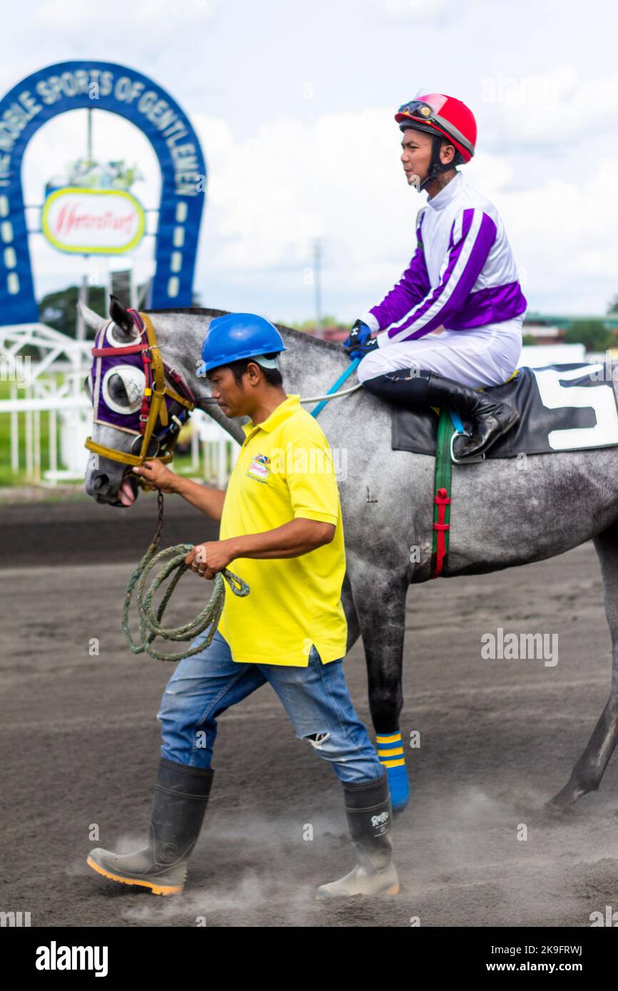 Horse racing at the Metroturf hippodrome in Tanauan, Batangas ...