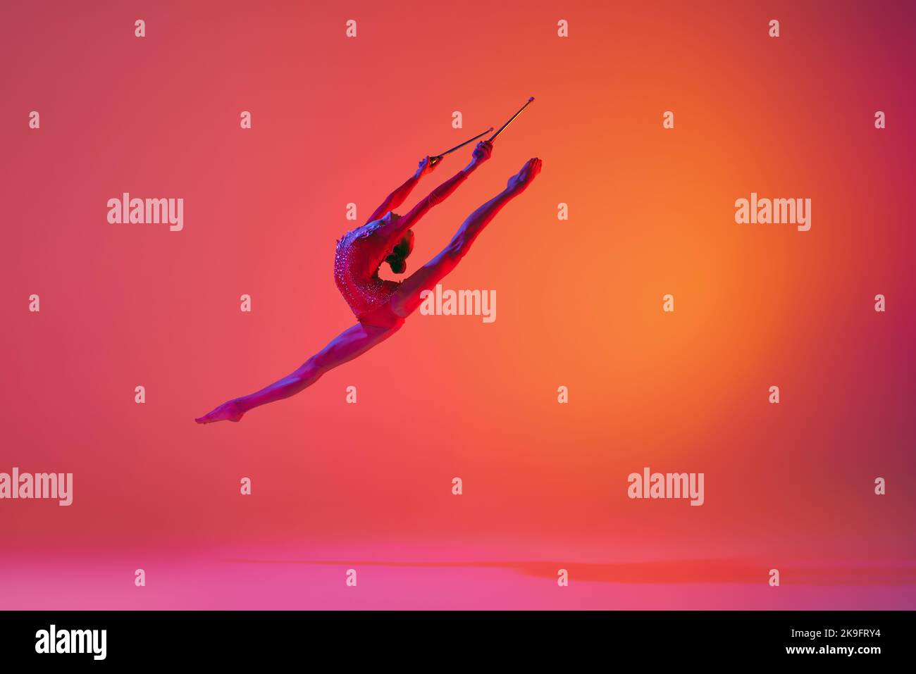 Beautiful and flexible graceful athlete rhythmic gymnastic artist ...