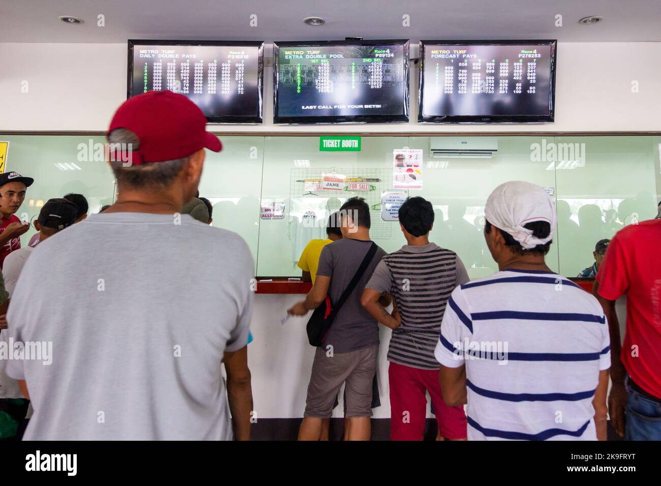 Horse racing at the Metroturf hippodrome in Tanauan, Batangas ...