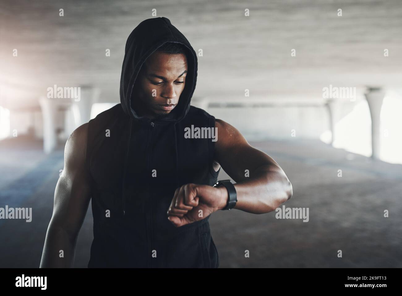 I think its time to call it a day. a handsome young man checking his ...