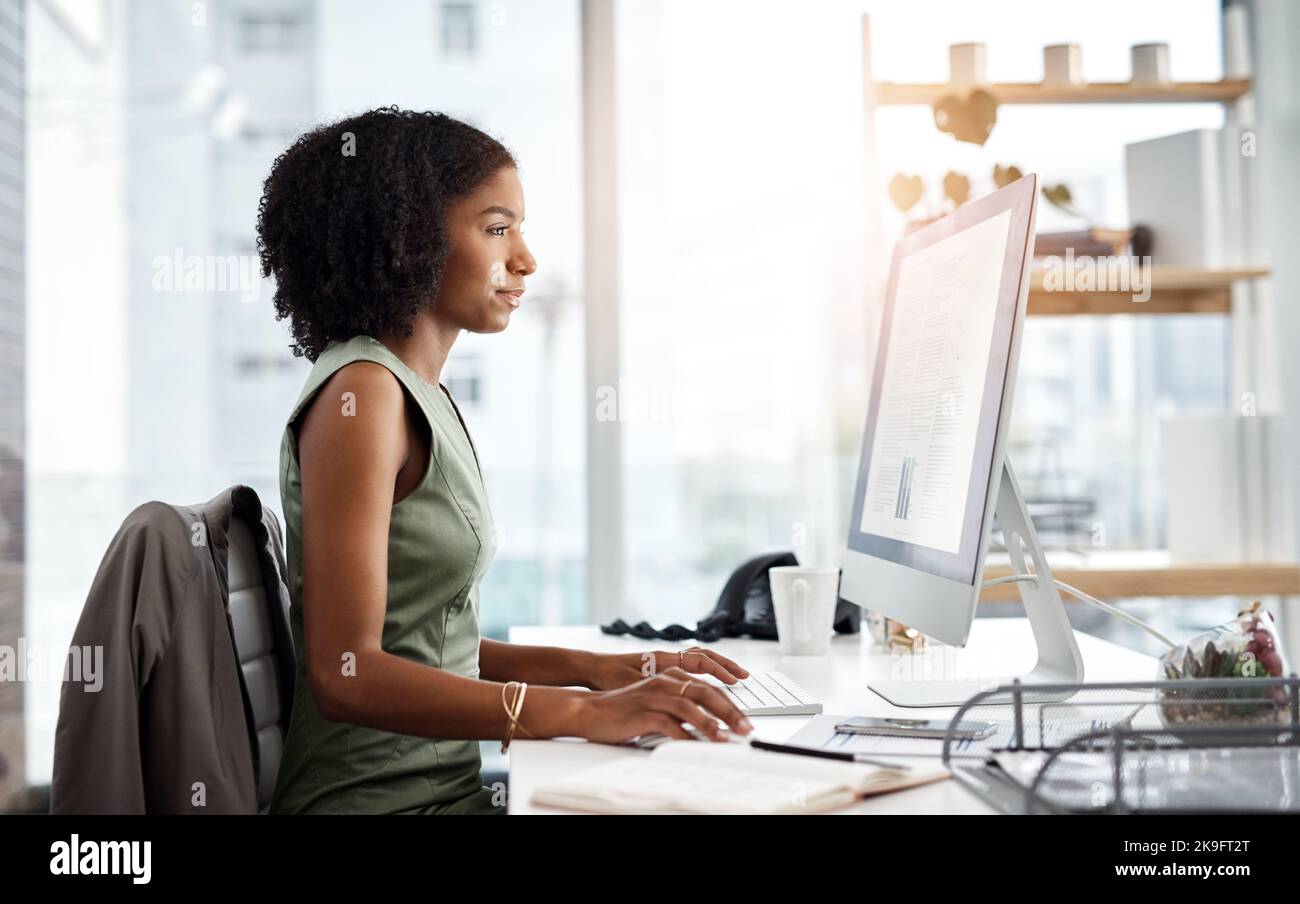 Nothing stops her from getting it done. a young businesswoman working ...
