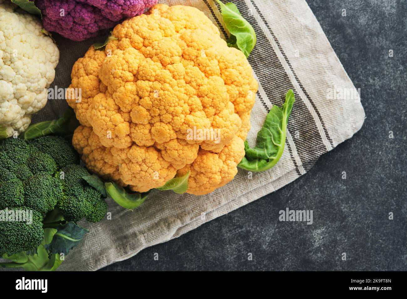 Colorful cauliflower. Various sort of cauliflower on old dark gray ...
