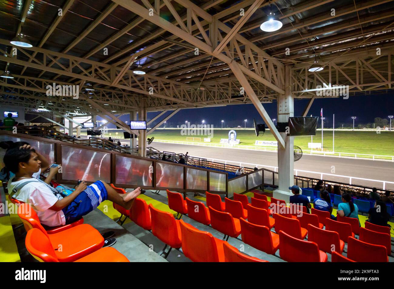 Horse racing at the Metroturf hippodrome in Tanauan, Batangas ...