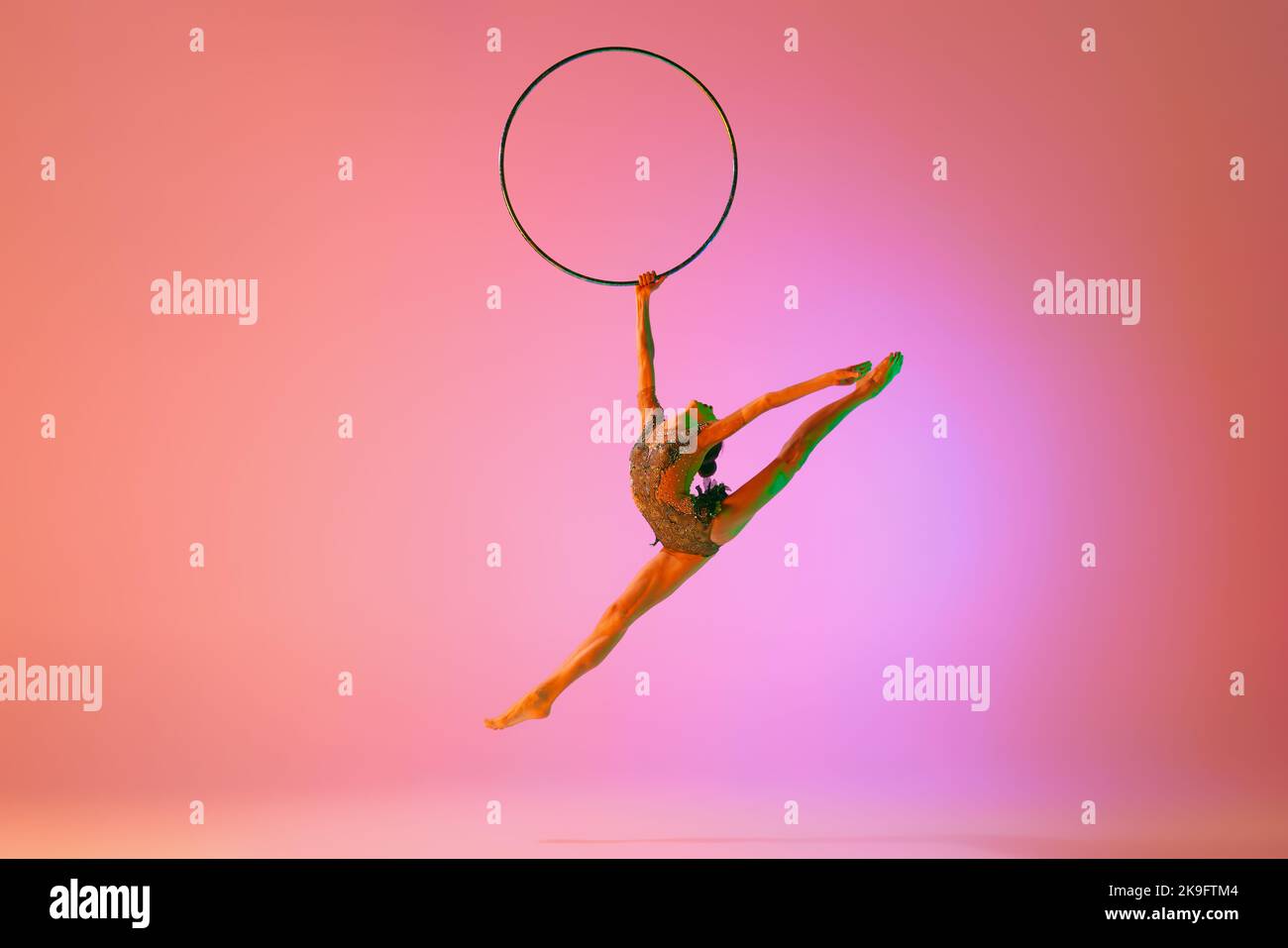 Beautiful and flexible graceful athlete rhythmic gymnastic artist ...