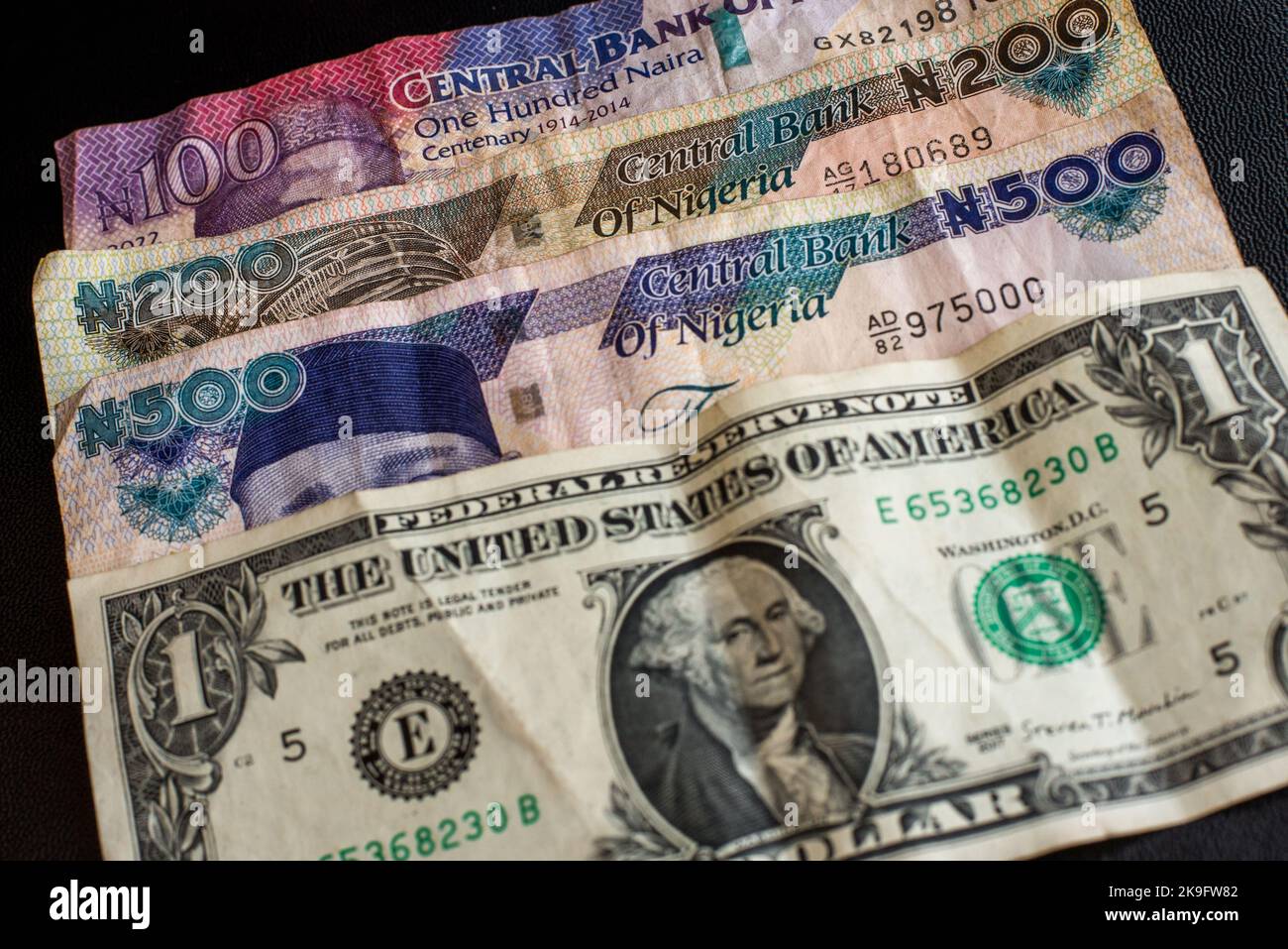 Big amount of Nigerian notes and a doller bill. Nigerian banknotes ...