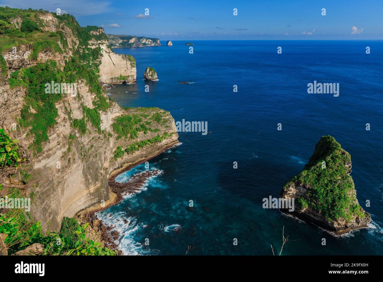 Scenic cliffs with blue ocean in Nusa Penida island Stock Photo - Alamy