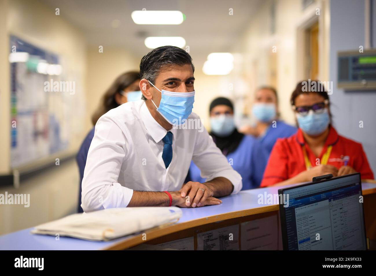 Prime Minister Rishi Sunak speaks with members of staff during a visit ...