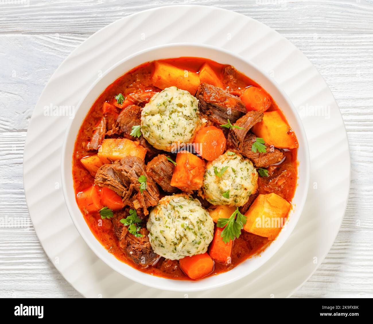 Beef Stew with Dumplings and vegetables in rich tomato and stock based ...
