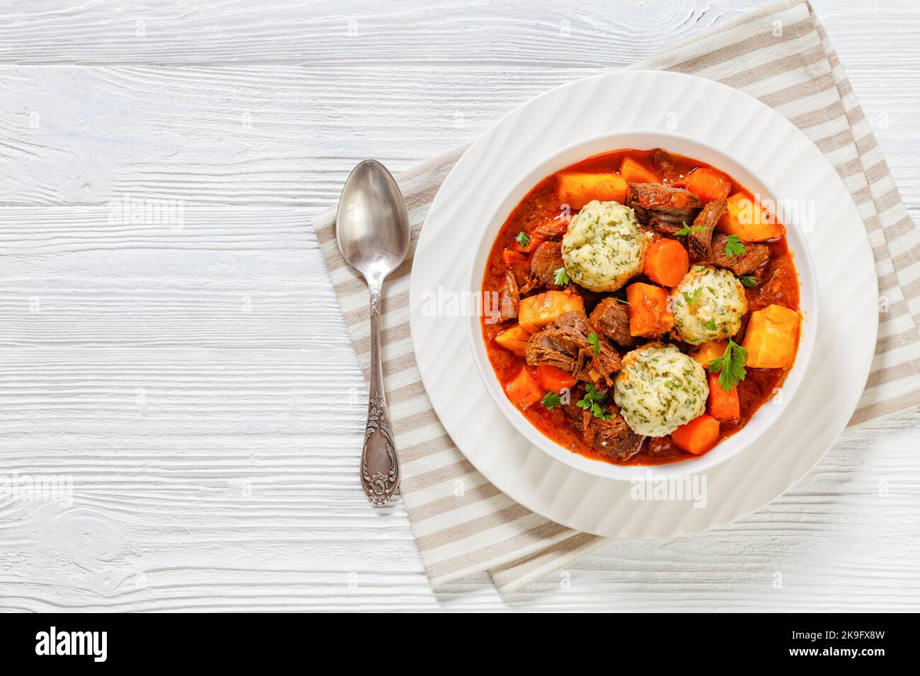 Beef Stew with Dumplings and vegetables in rich tomato and stock based ...