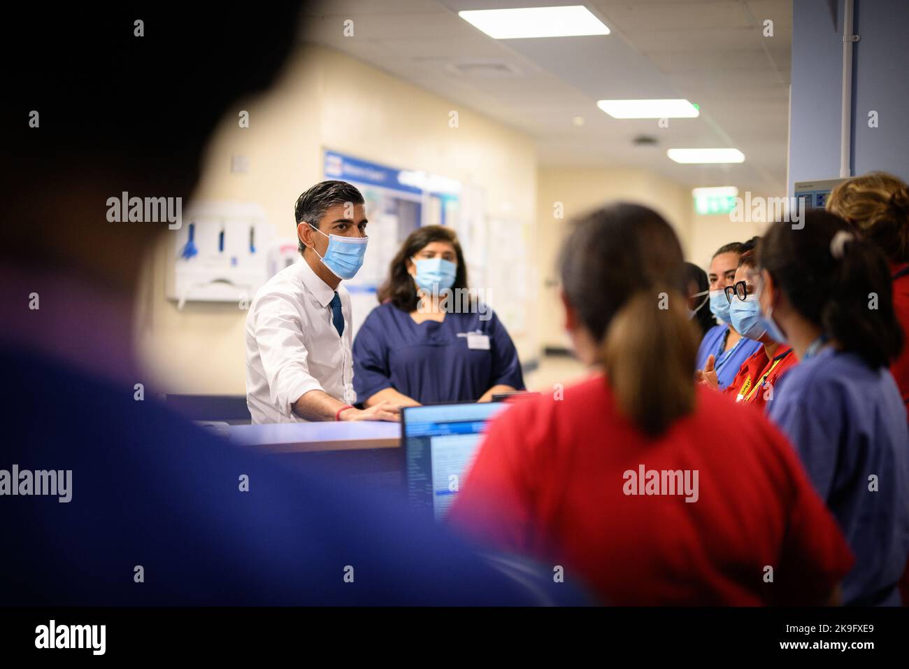 Prime Minister Rishi Sunak speaks with members of staff during a visit ...
