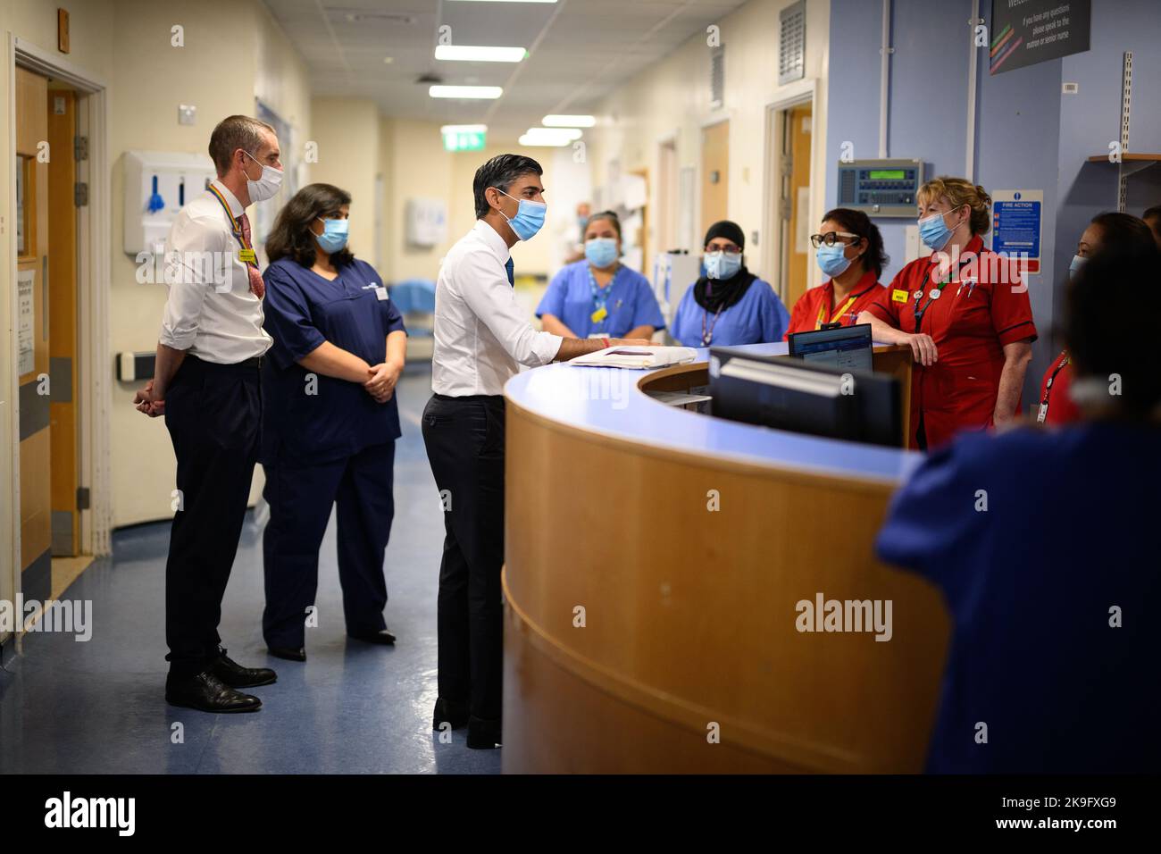 Prime Minister Rishi Sunak speaks with members of staff during a visit ...