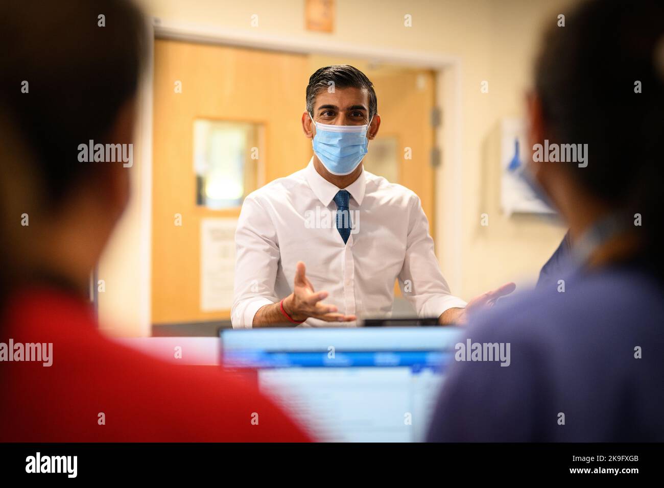 Prime Minister Rishi Sunak speaks with members of staff during a visit ...