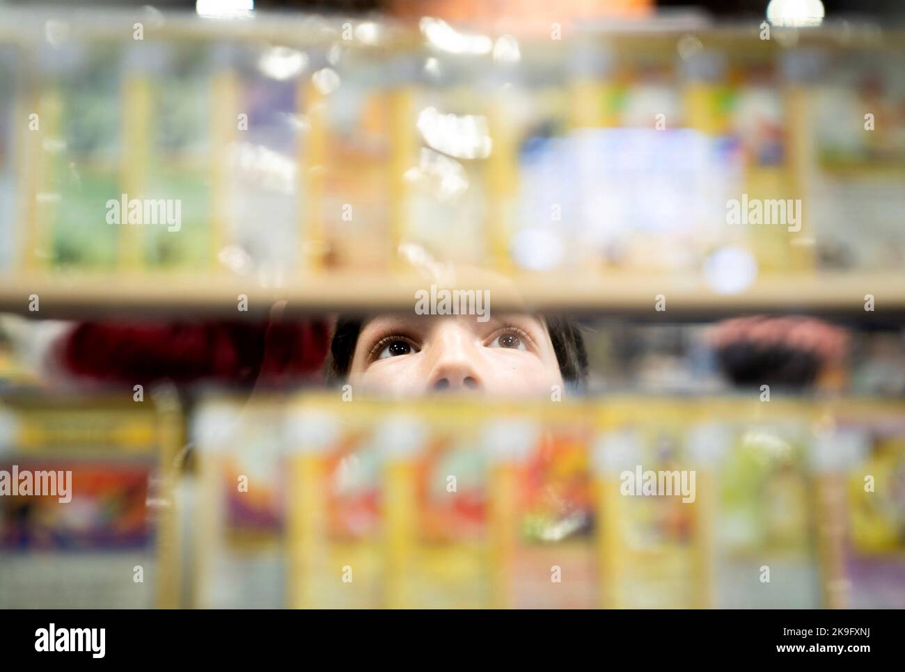 A boy looks at trading cards during MCM Comic Con at the ExCel London ...