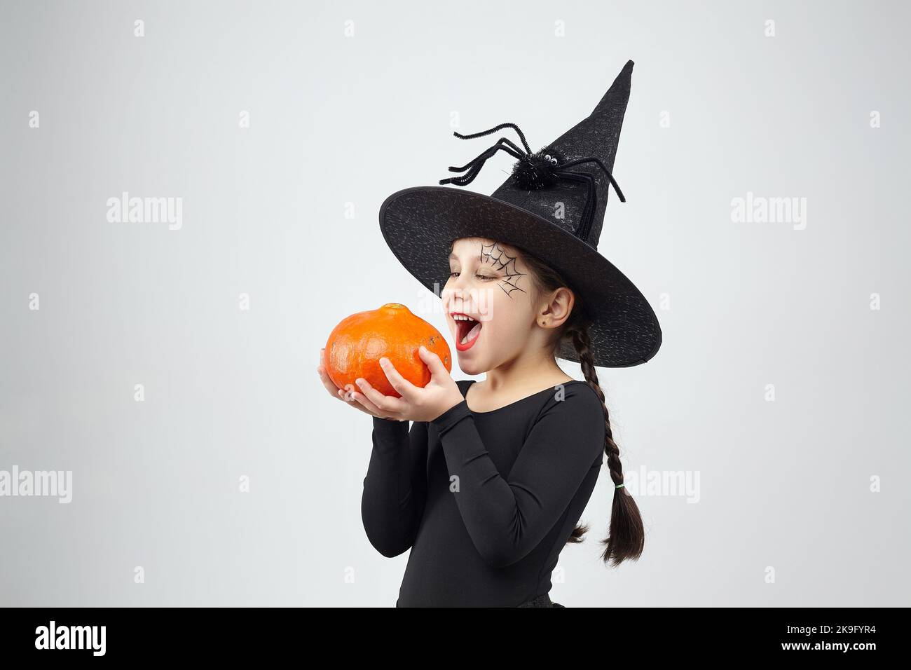 portrait of a charming little girl in a witch costume, Jack's lamps are ...