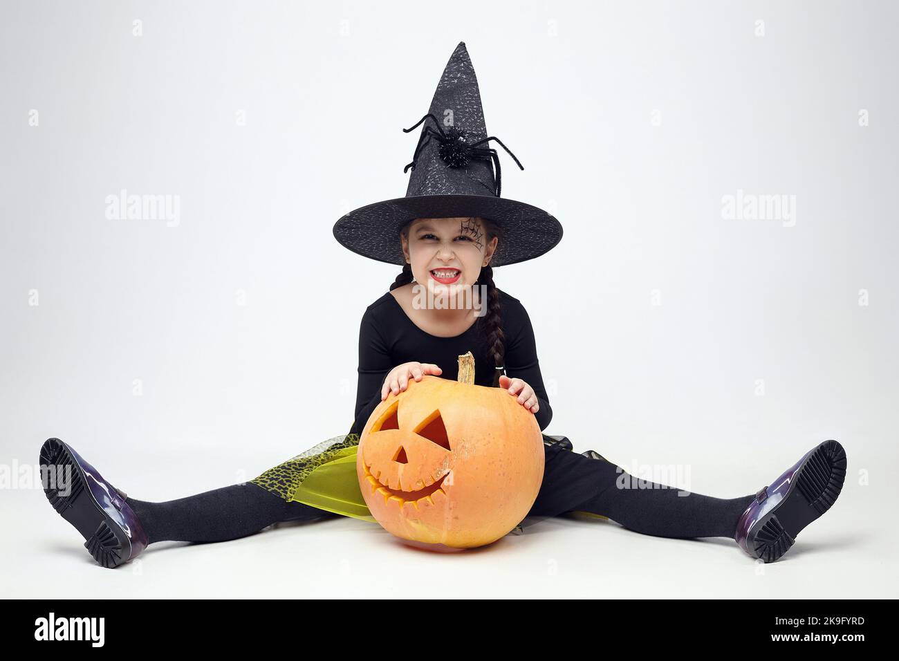 portrait of a charming little girl in a witch costume, Jack's lamps are ...
