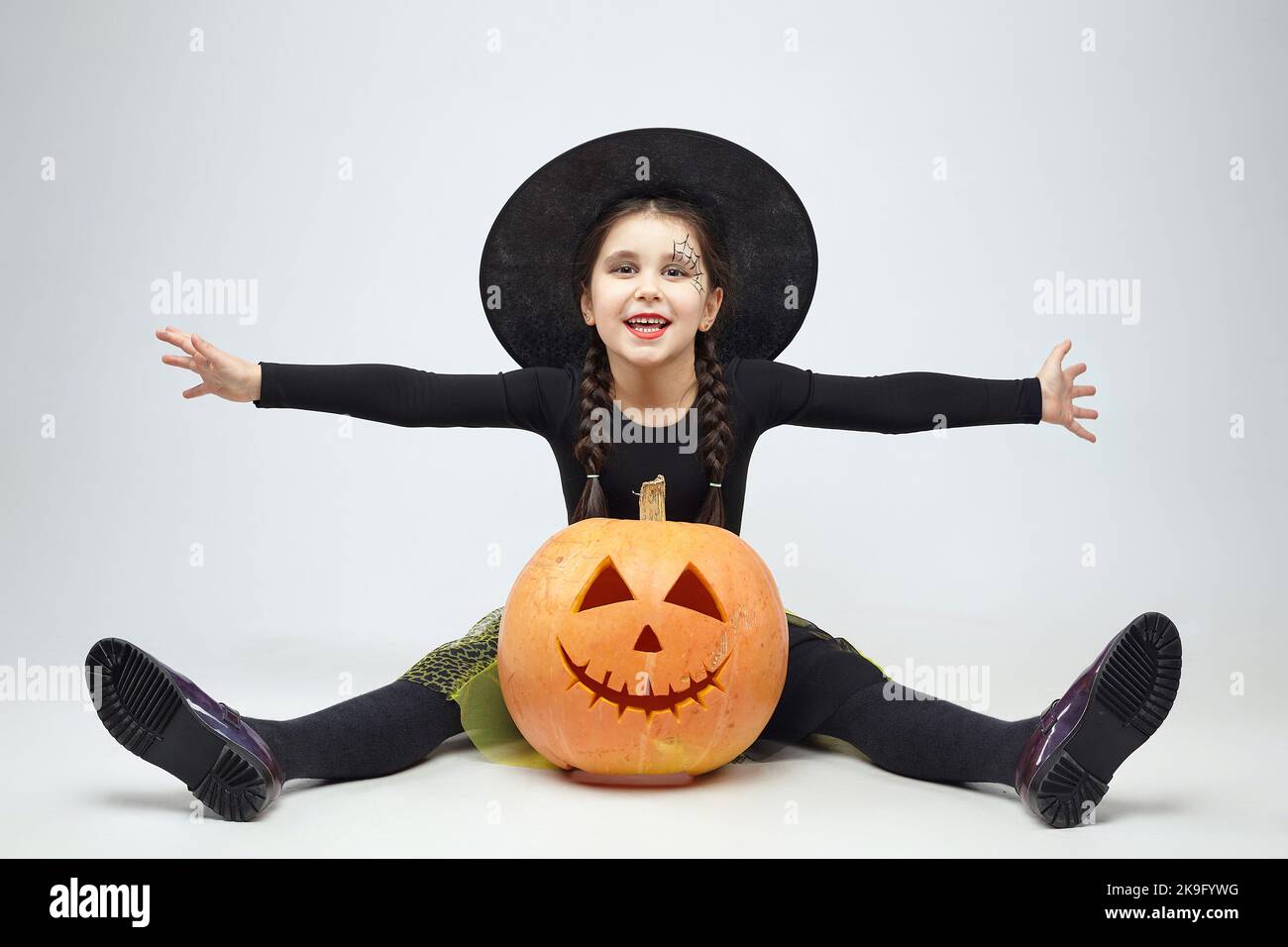 portrait of a charming little girl in a witch costume, Jack's lamps are ...