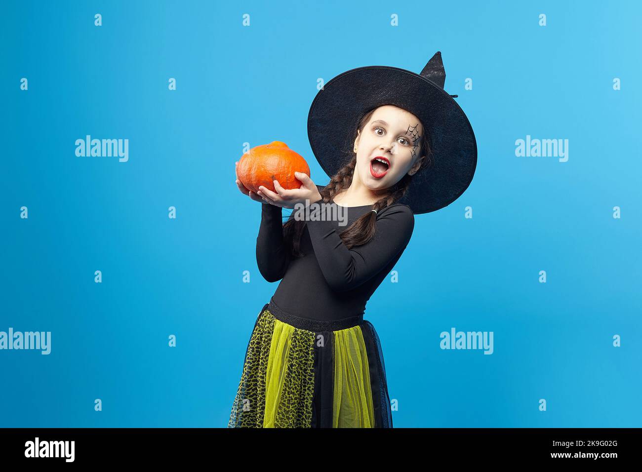 portrait of a charming little girl in a witch costume, Jack's lamps are ...