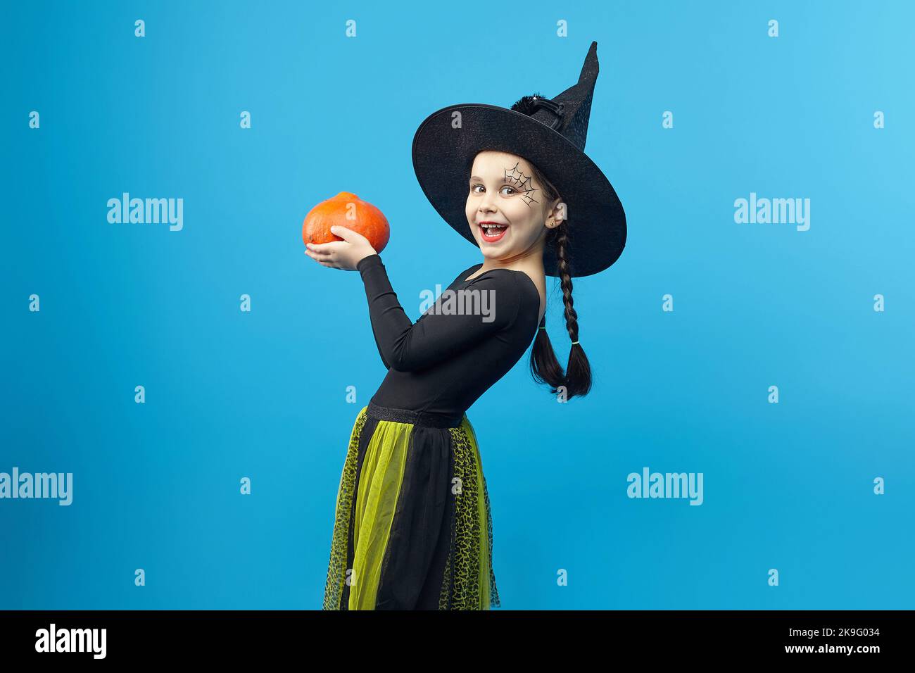 portrait of a charming little girl in a witch costume, Jack's lamps are ...