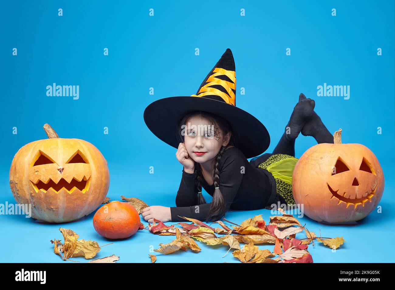 portrait of a charming little girl in a witch costume, Jack's lamps are ...