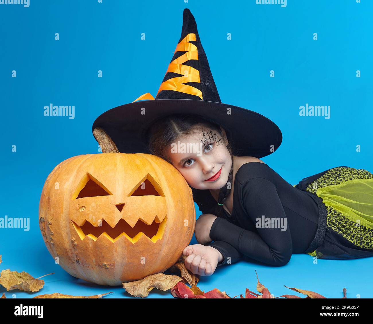 portrait of a charming little girl in a witch costume, Jack's lamps are ...