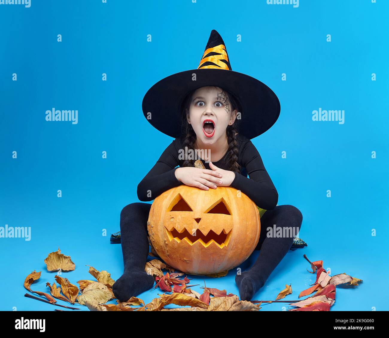 portrait of a charming little girl in a witch costume, Jack's lamps are ...