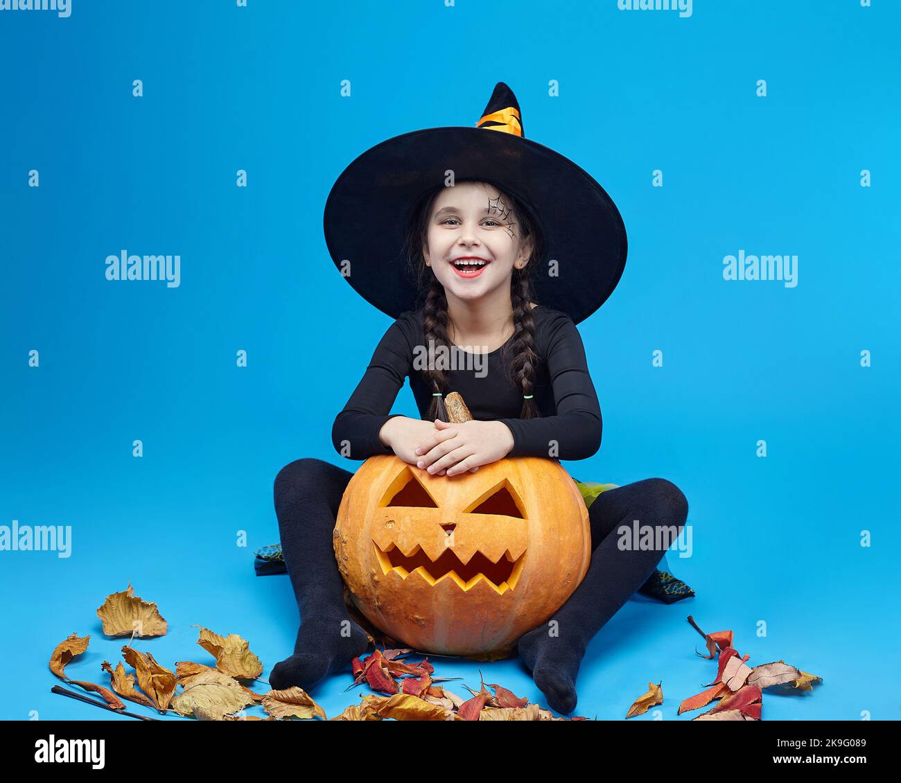 portrait of a charming little girl in a witch costume, Jack's lamps are ...