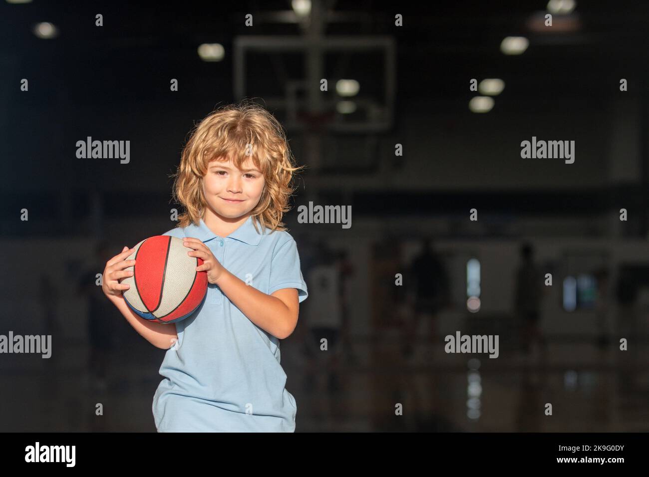 Child playing basketball at school. Activity and sport for kids Stock ...