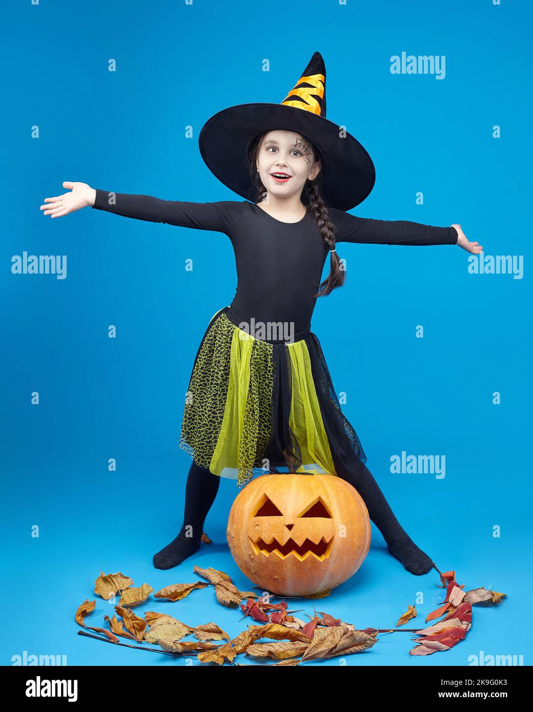 portrait of a charming little girl in a witch costume, Jack's lamps are ...
