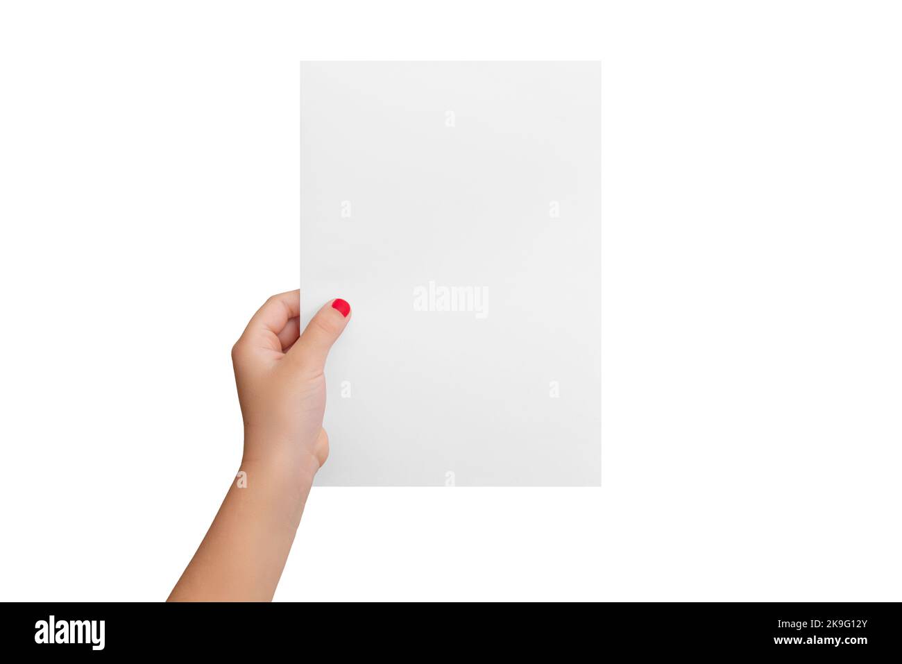 Isolated girl's hand hold a blank paper in a vertical position. Copy ...