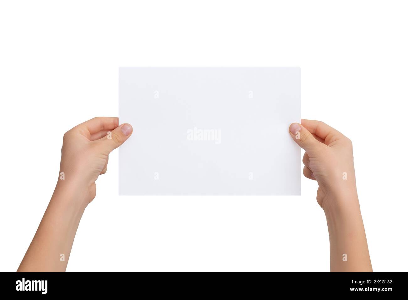 White sheet of paper in the hands of a boy. Horizontal position ...
