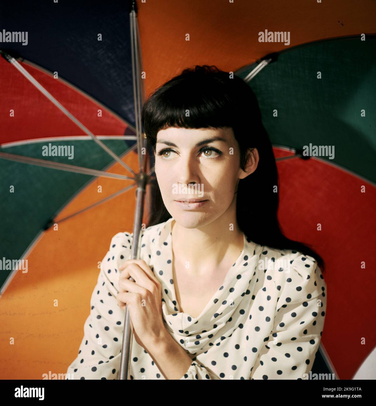 Fringed slim woman with colourful umbrella c1969 by Gilbert Adams (1906 ...