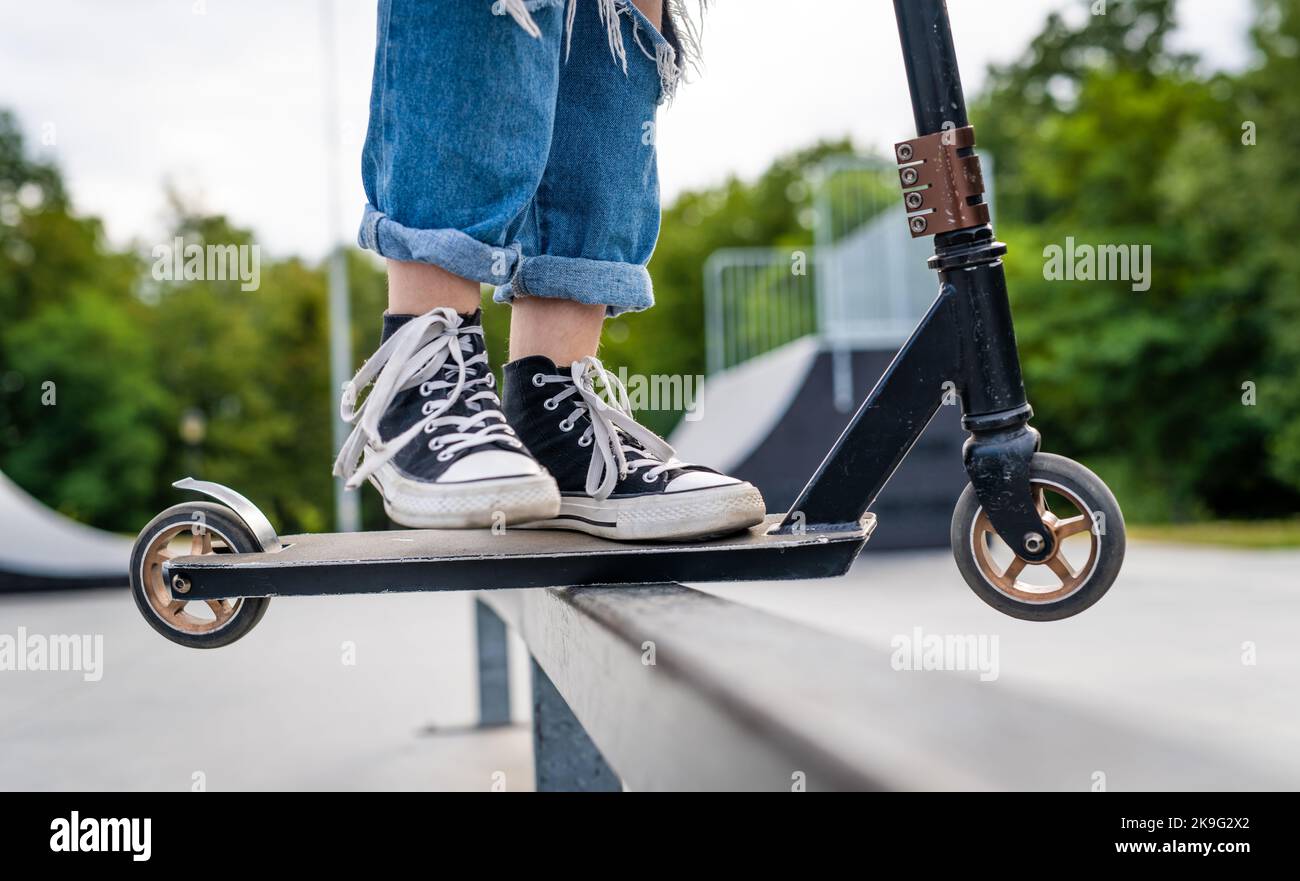 Girl with scooter Stock Photo - Alamy