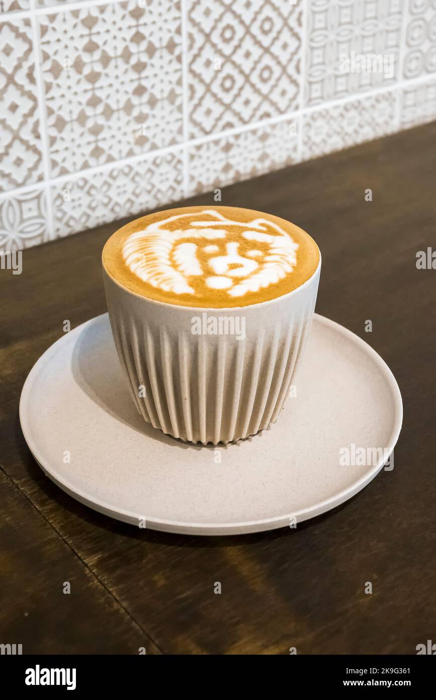 Freshly brewed latte in a beige porcelain coffee cup in a cafe Stock ...