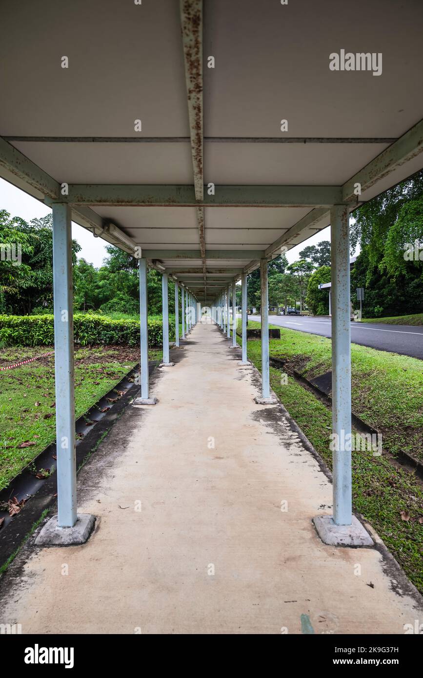 Empty walkway in Seletar Aerospace Park, with rusty metal columns Stock ...