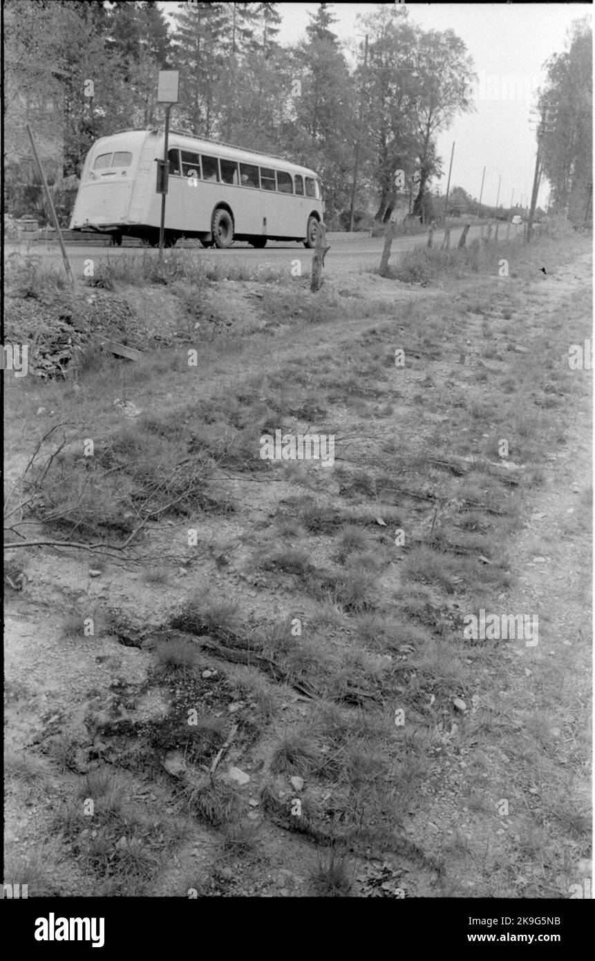 State railways, SJ bus at bus stop. Remains of the closed and upset ...