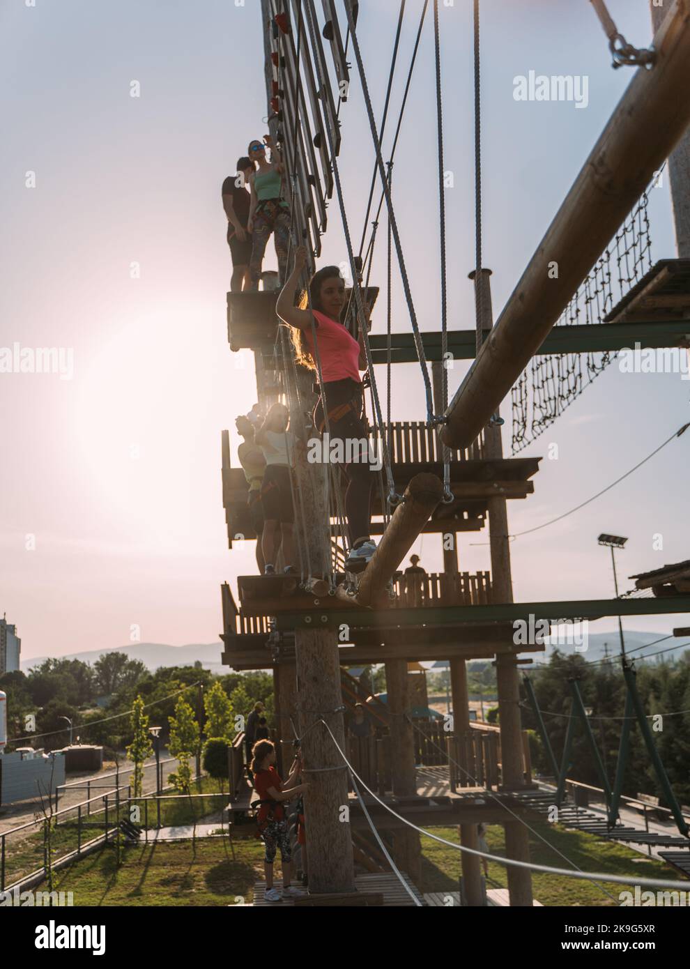 Group of amazing adventure people climbing at the adventure park Stock ...