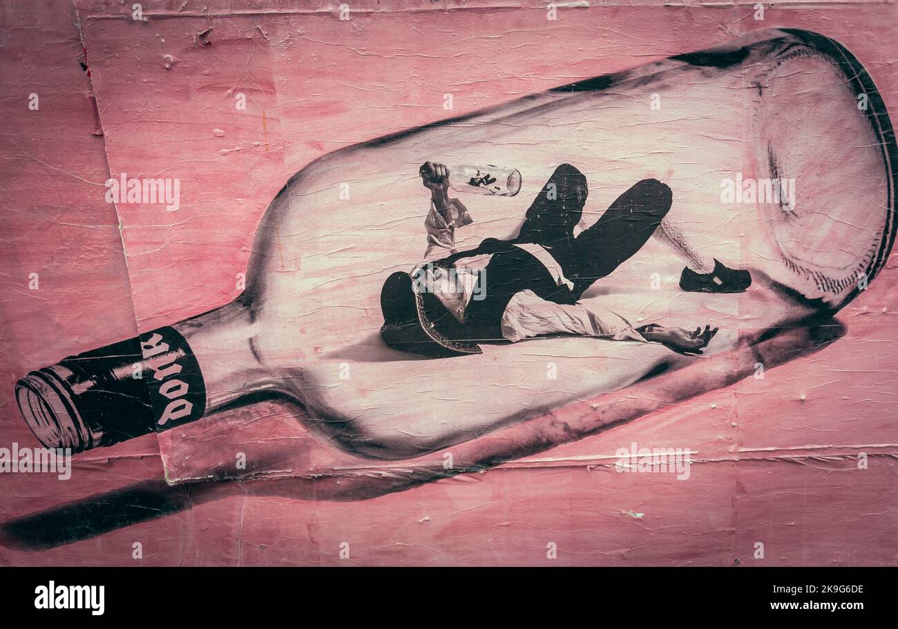 A graffiti drawing of a drunken man in a bottle, street art painting in ...