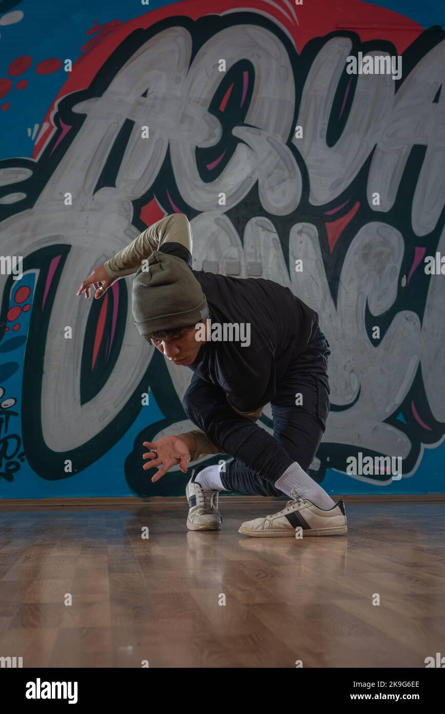 Modern rapper dancing in garage. Urban lifestyle, hip hop Stock Photo ...