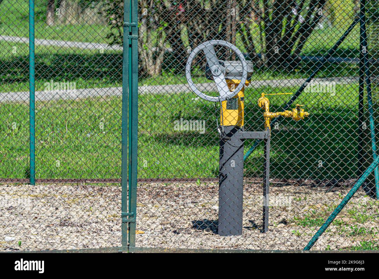 Pipeline with valve. pipe with a blue tap at a natural gas compressor ...