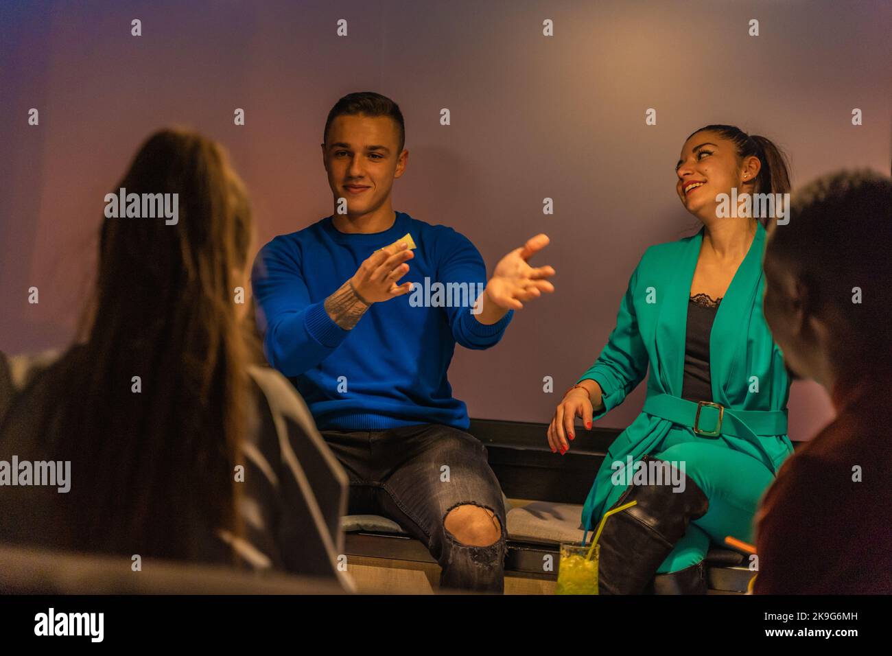 Attractive and strong guy is explaining the word while smiling Stock ...