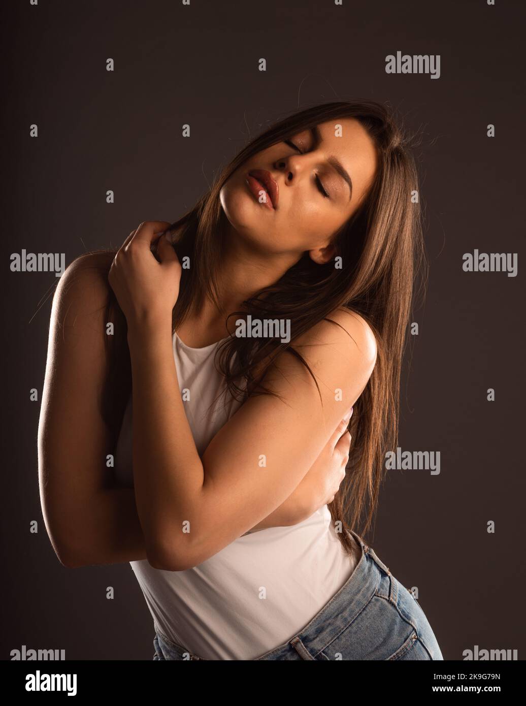 Body shot of an attractive female model posing in modern style clothes ...