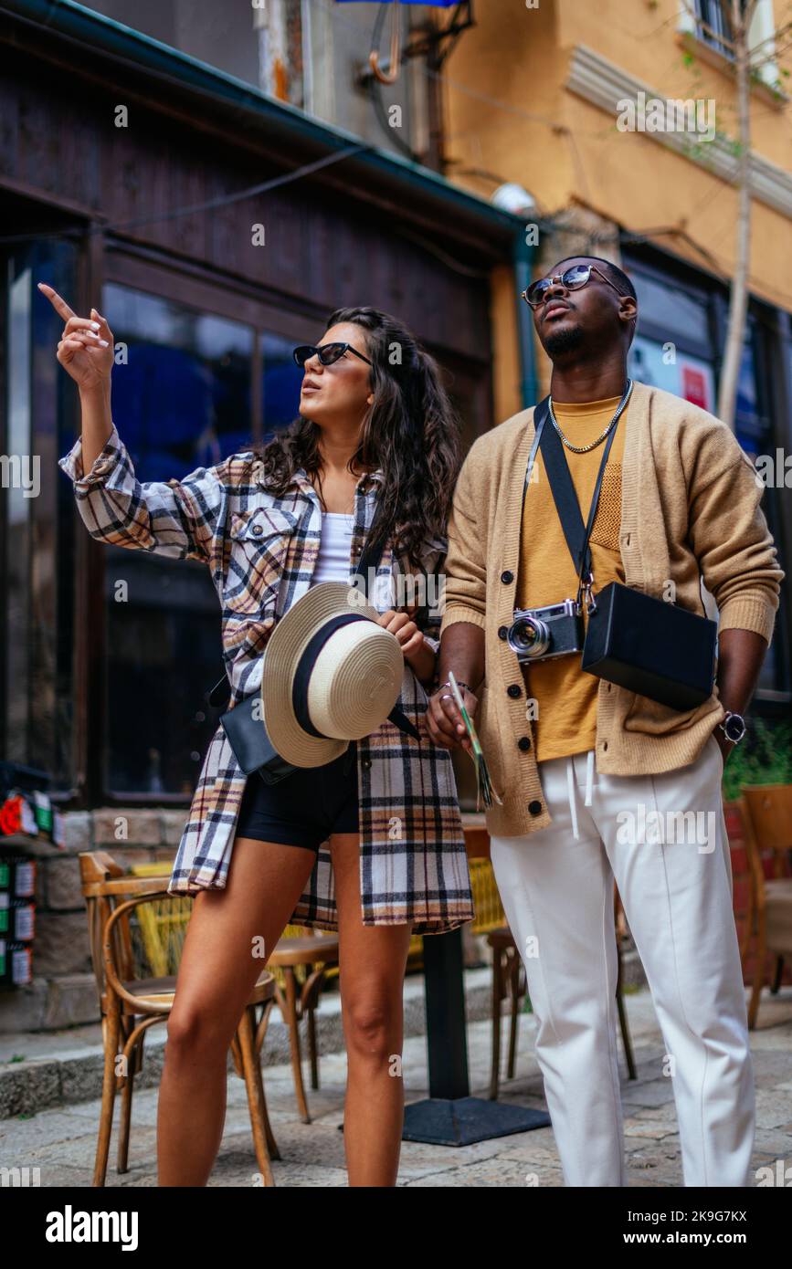 African american girl pointing map hi-res stock photography and images ...