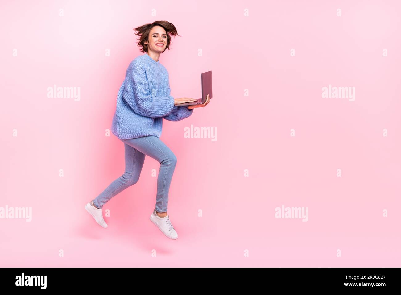 Full size profile portrait of cheerful gorgeous girl hurry rush hold ...