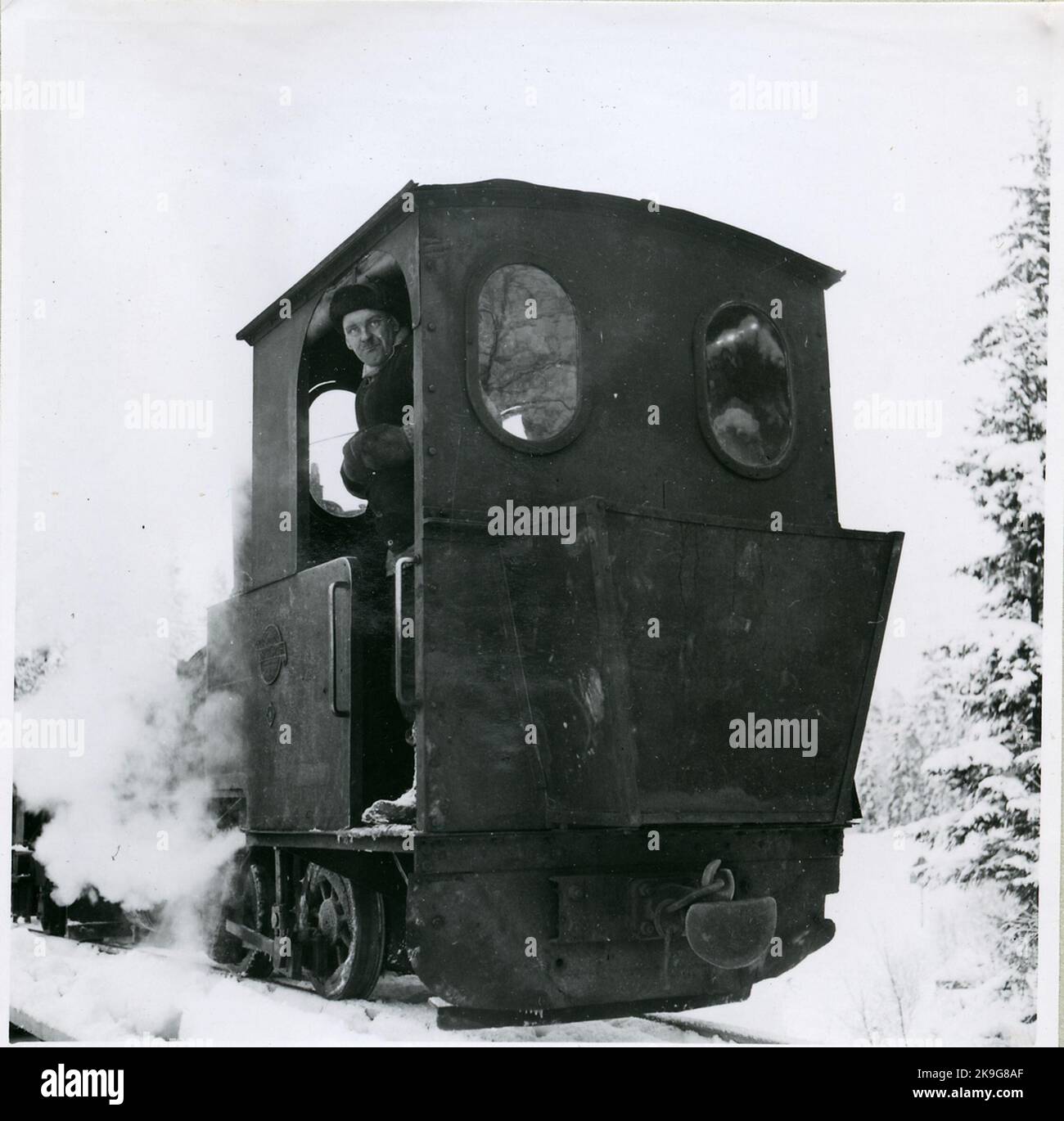 Steam locomotive at double track building on the line between ...