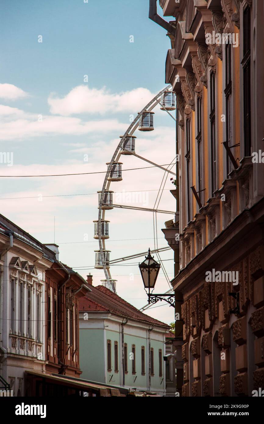 Ferris wheel on the streets of Eger Stock Photo - Alamy