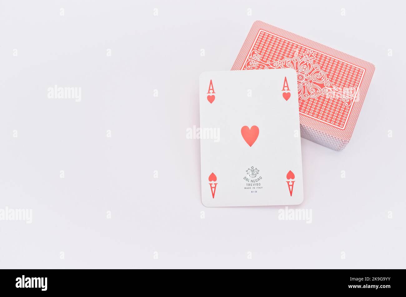 poker playing cards and ace on a white table with copy space Stock ...