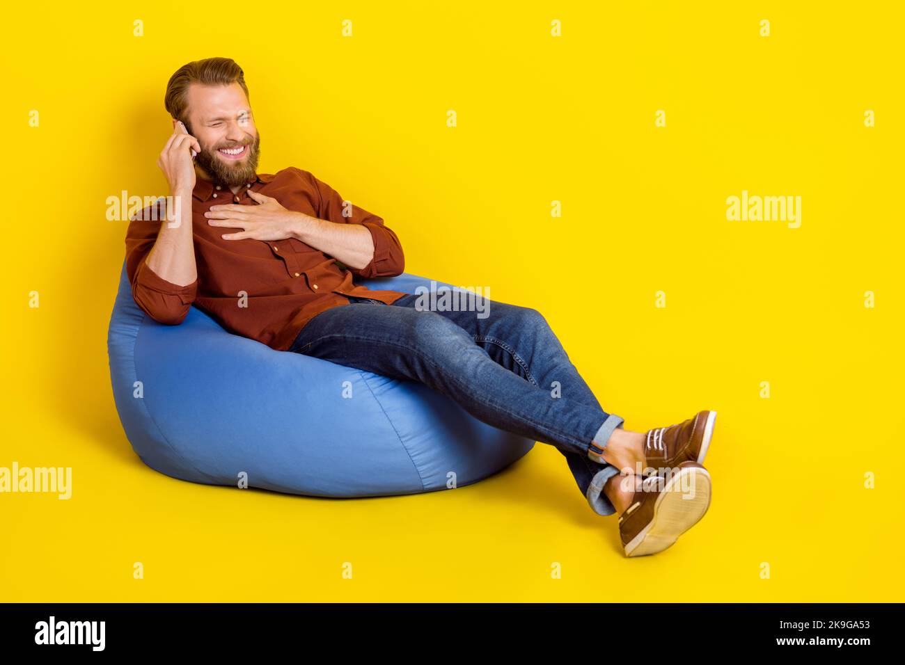 Full body portrait of crazy cheerful person sit bag hand touch chest ...