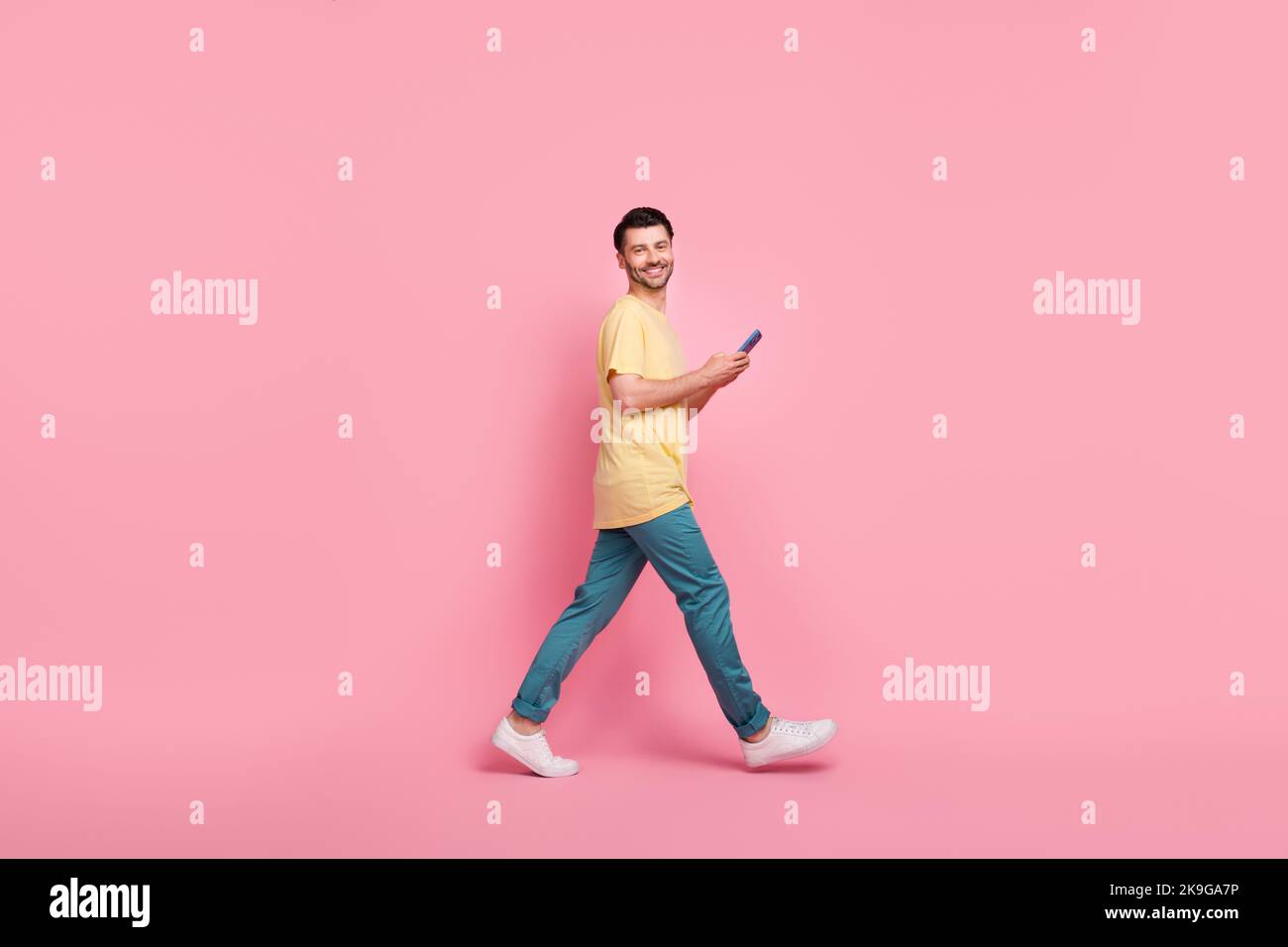 Full length profile side photo of good looking cheerful man go empty ...