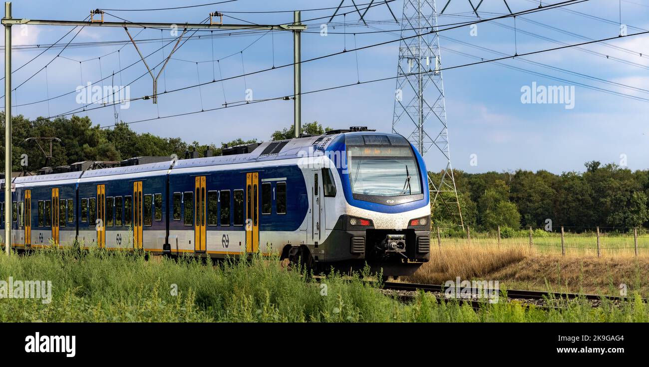 A sunny day while a NS sprinter train riding on a Dutch railway Stock ...